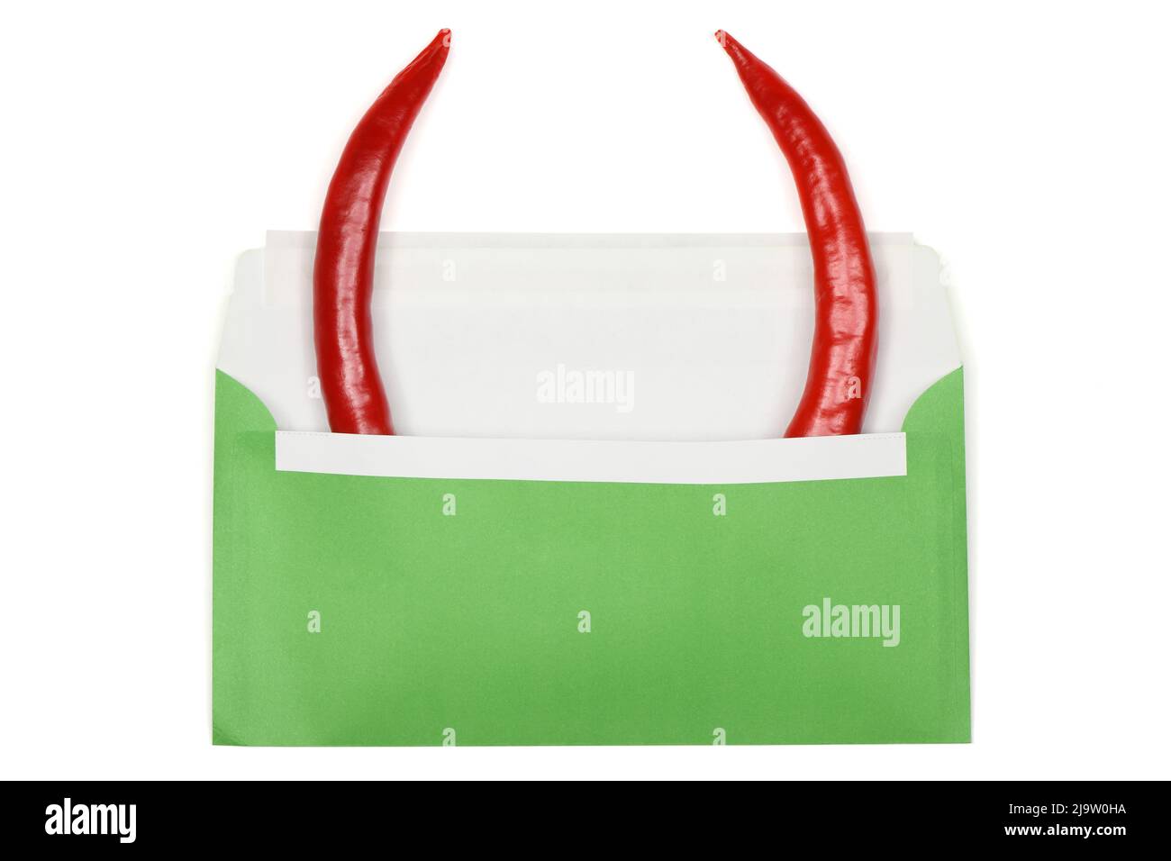 Red chili pepper in a mailing envelope isolated on a white background ...