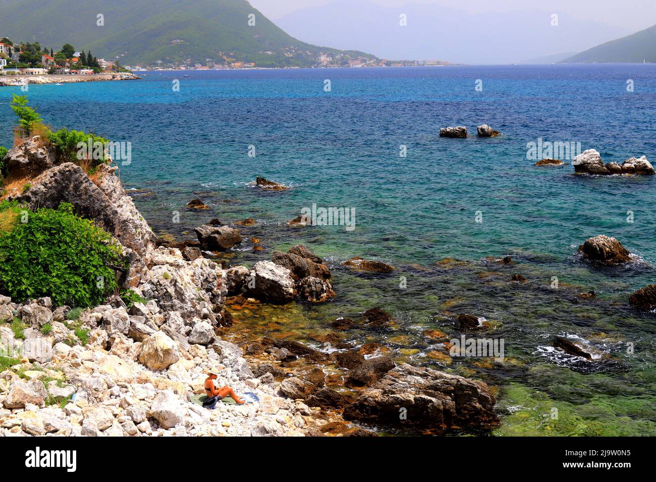 Beach, sea coast with beautiful, picturesque rocks, mountains and clear ...