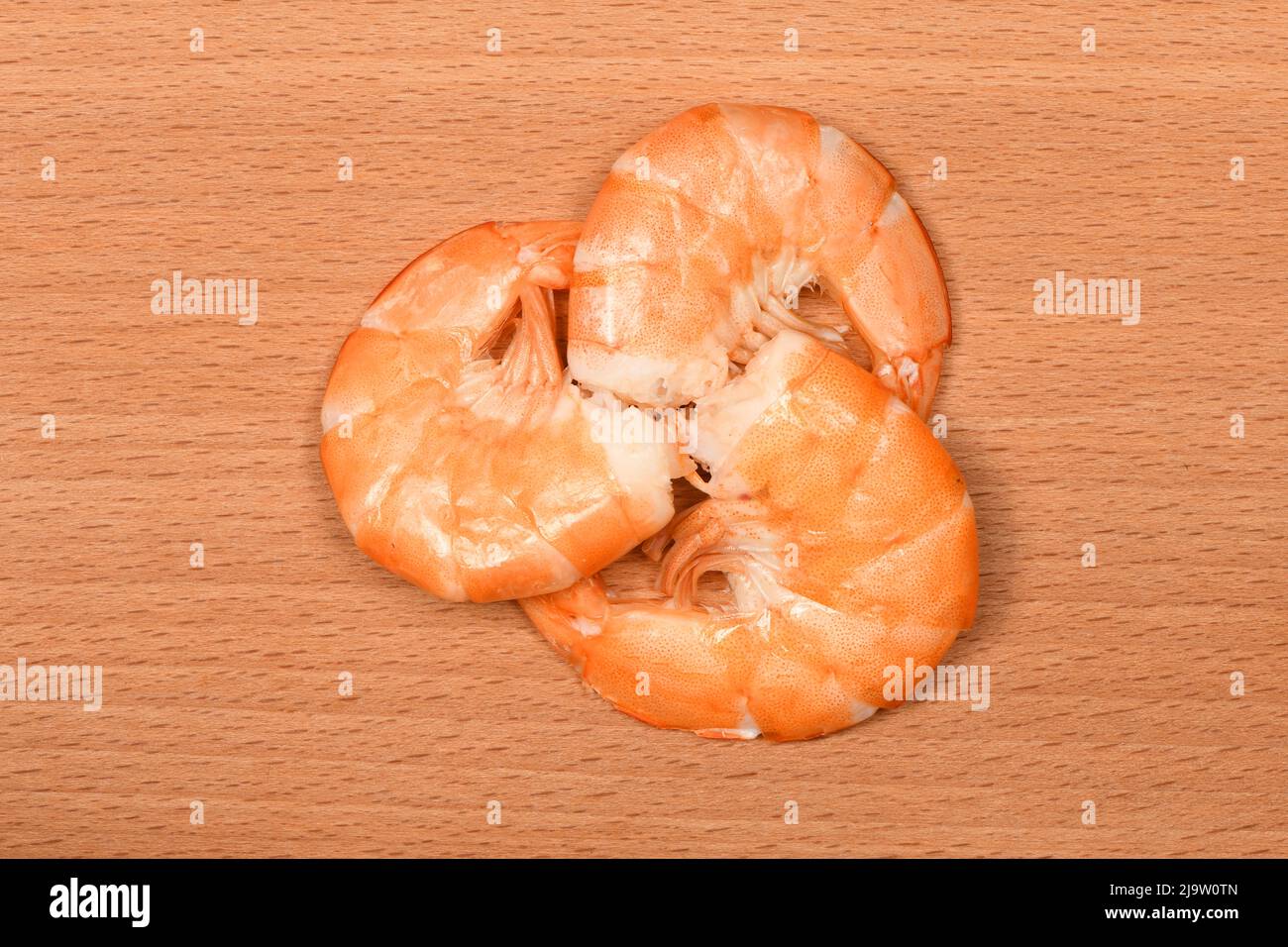 Perfectly retouched shrimp on wood background. High resolution photo ...