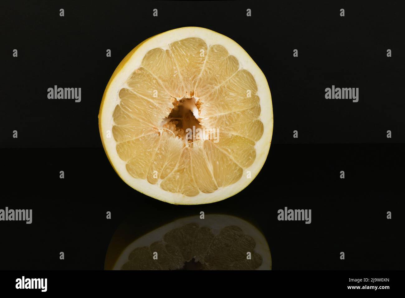 Pomelo isolated on acrylic black background. High resolution photo ...