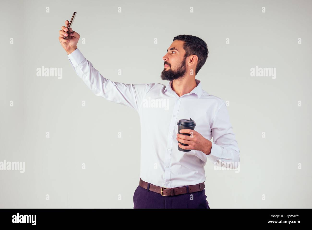 handsome Arab Sheikh businessman black beard in a white shirt and black ...