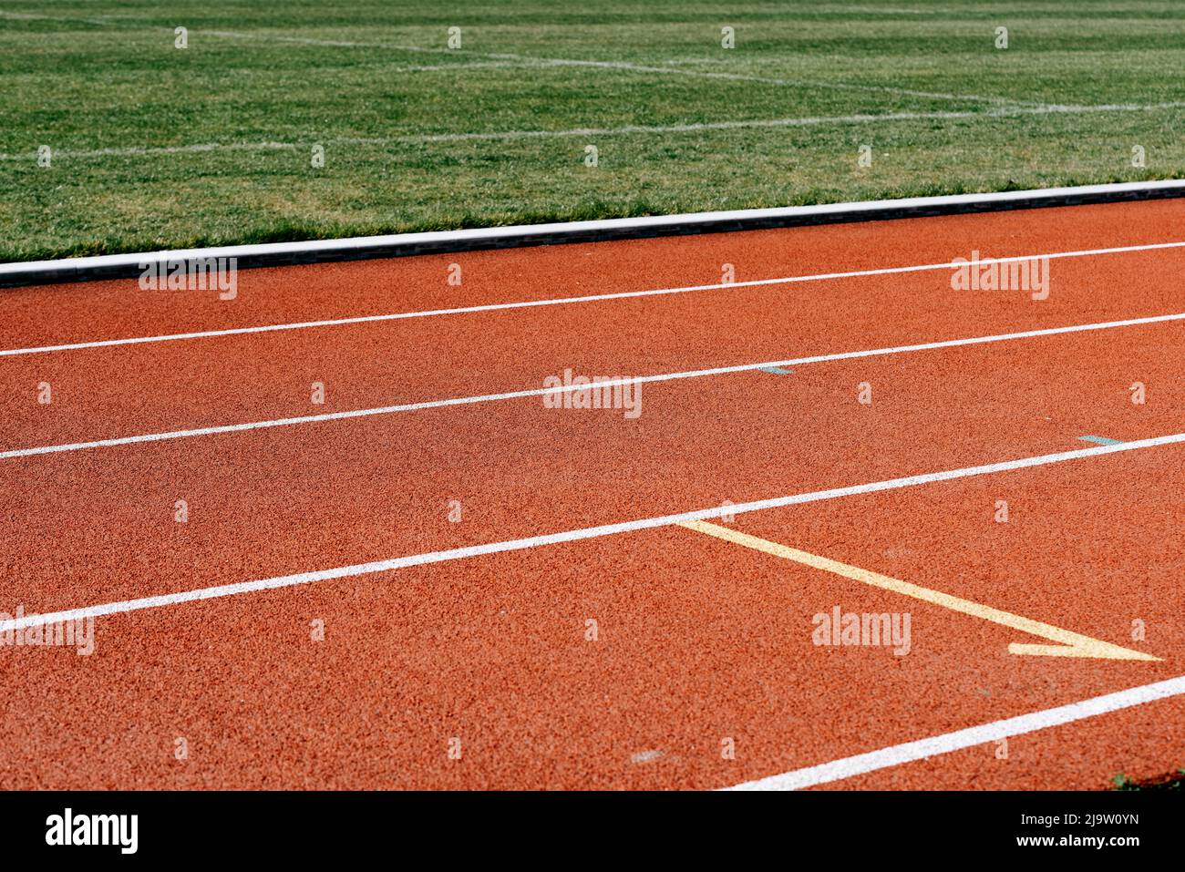 sports track around the sports field Stock Photo - Alamy