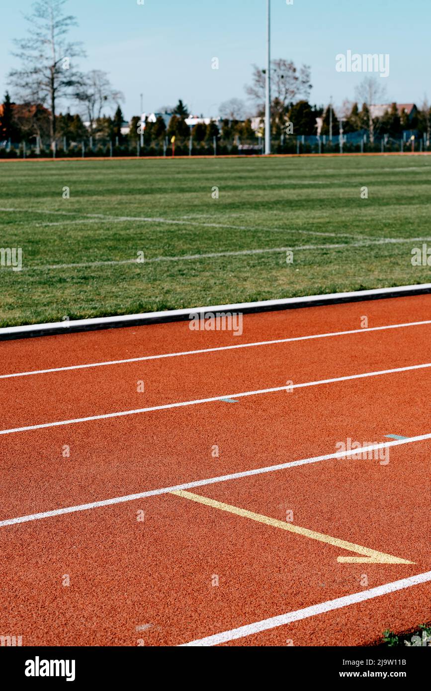 sports track around the sports field Stock Photo - Alamy