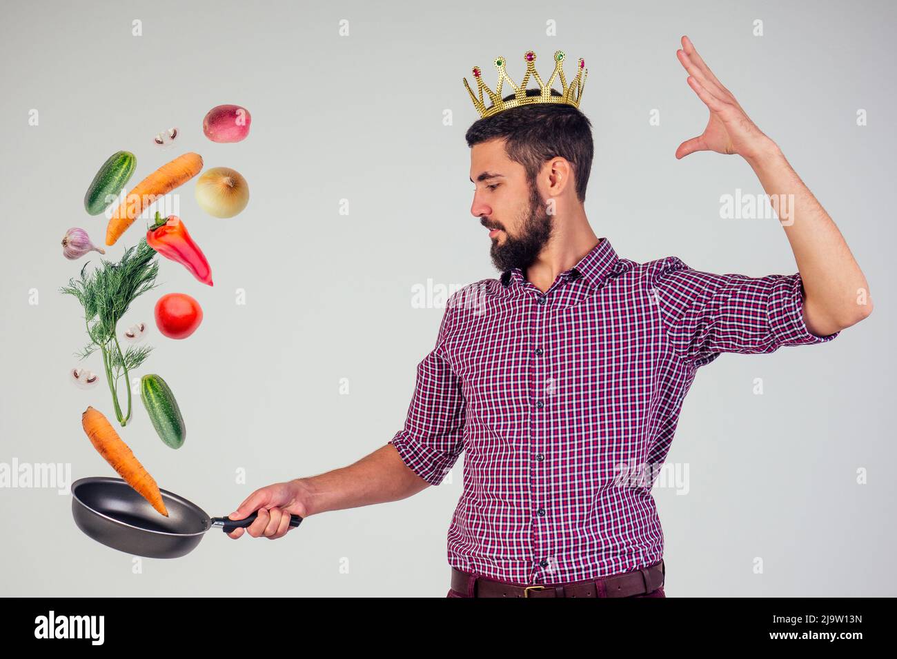 king of the kitchen with a golden crown on head chef holding a frying ...