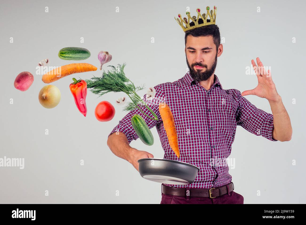 king of the kitchen with a golden crown on head chef holding a frying ...