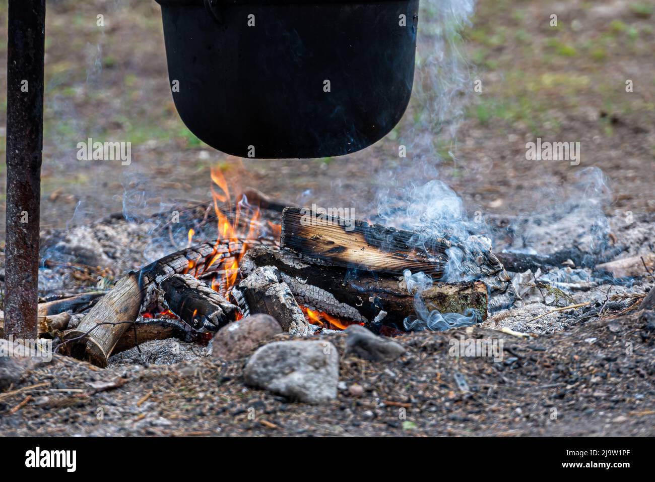 cooking food on a campfire in the woods, food camping concept, place ...
