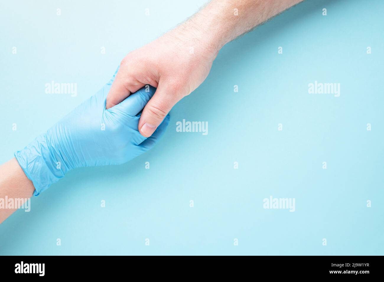 Forbidden touch concept between femal's hand in medical glove and man's ...