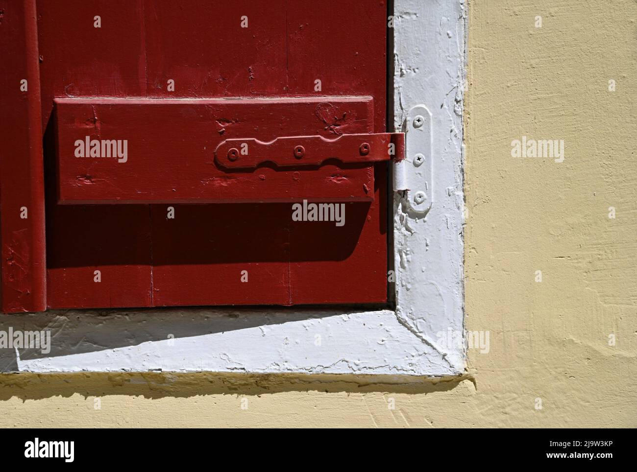 Old traditional rural house carmine red wooden window shutter with ...