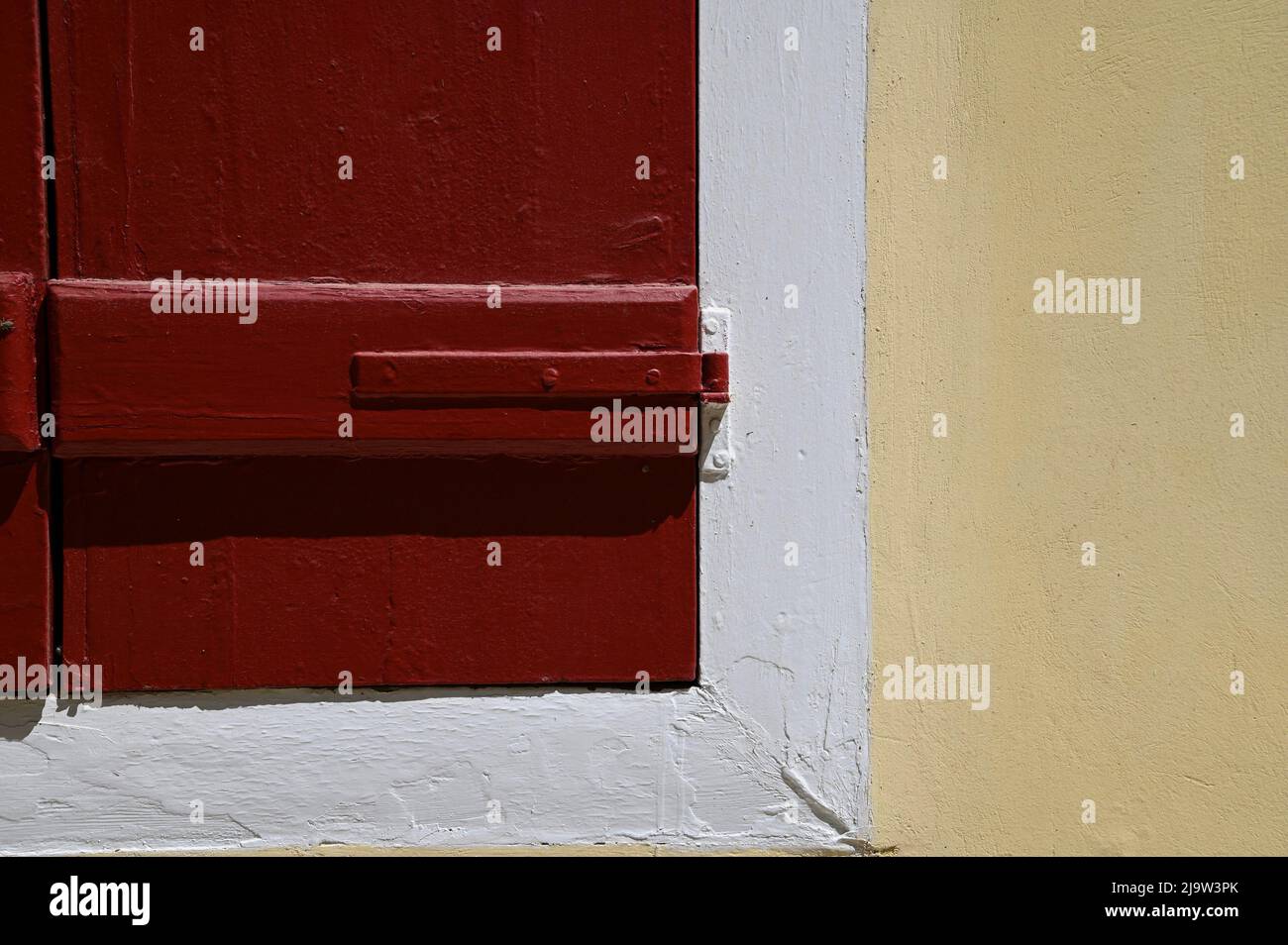 Old traditional rural house carmine red wooden window shutter with ...