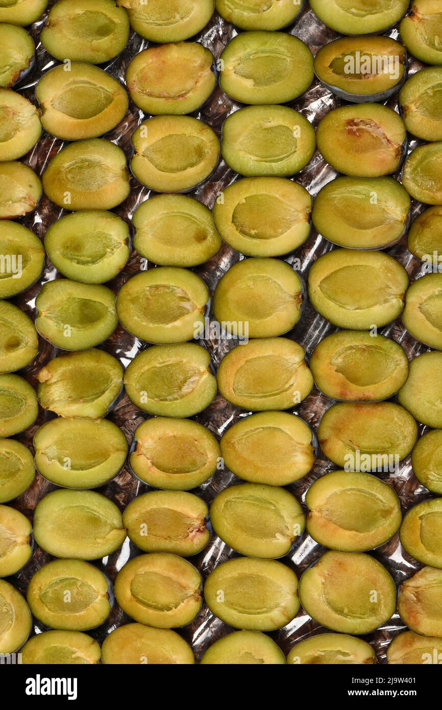 Sliced plums before home freezing. High resolution photo. Full depth of ...