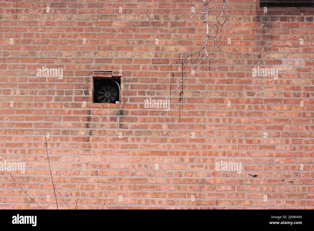A minimalist view of a common brick wall with a vent Stock Photo - Alamy