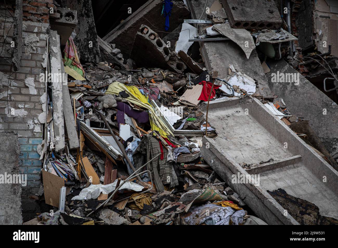 The ruins of a destroyed residential building seen in the city of ...