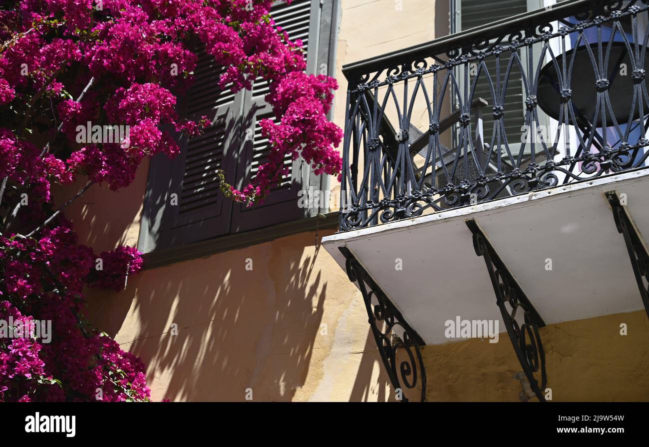 Old Neoclassical house facade with wooden window shutters a balcony ...