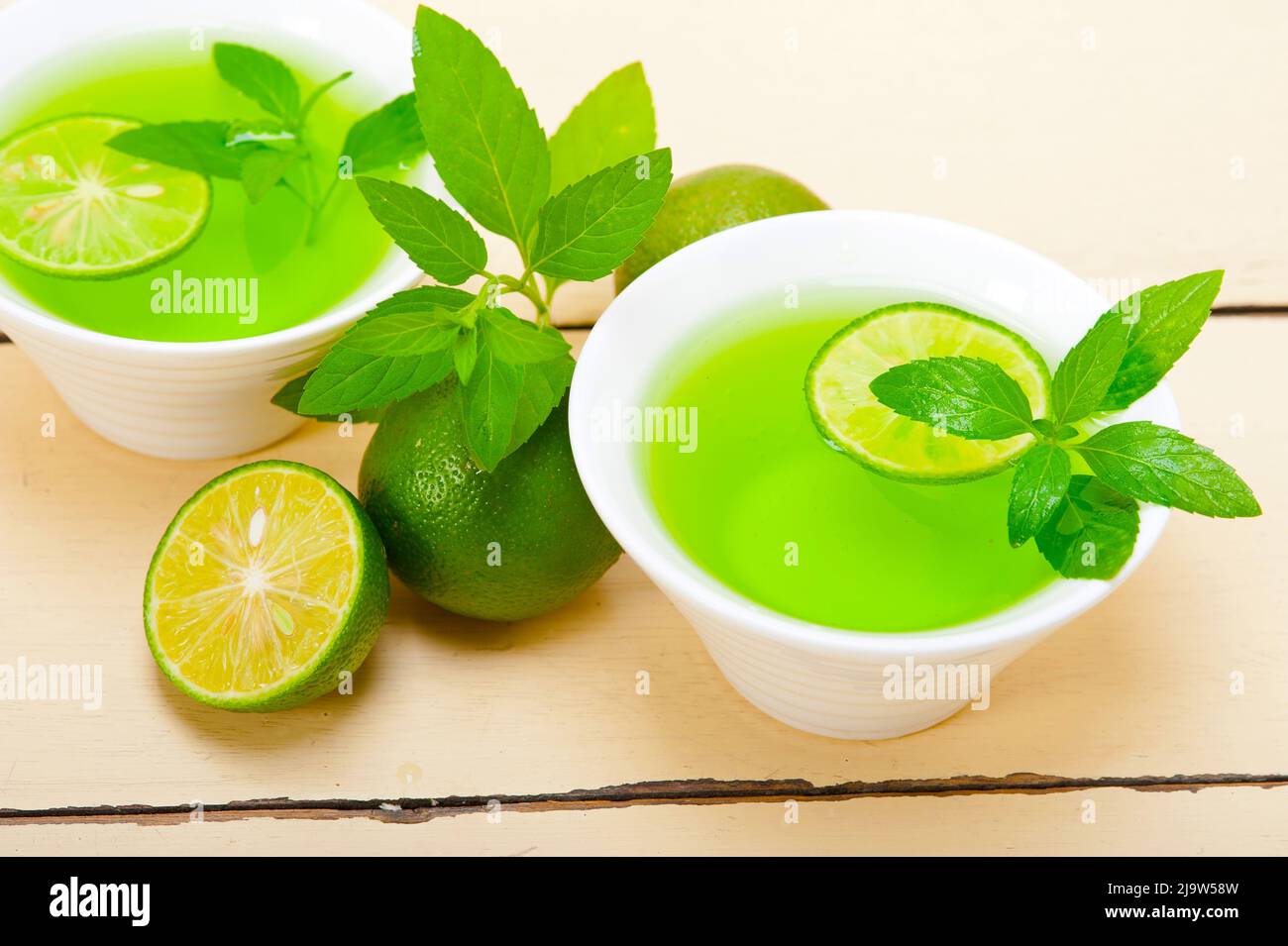 fresh and healthy mint infusion tea tisane with lime Stock Photo - Alamy