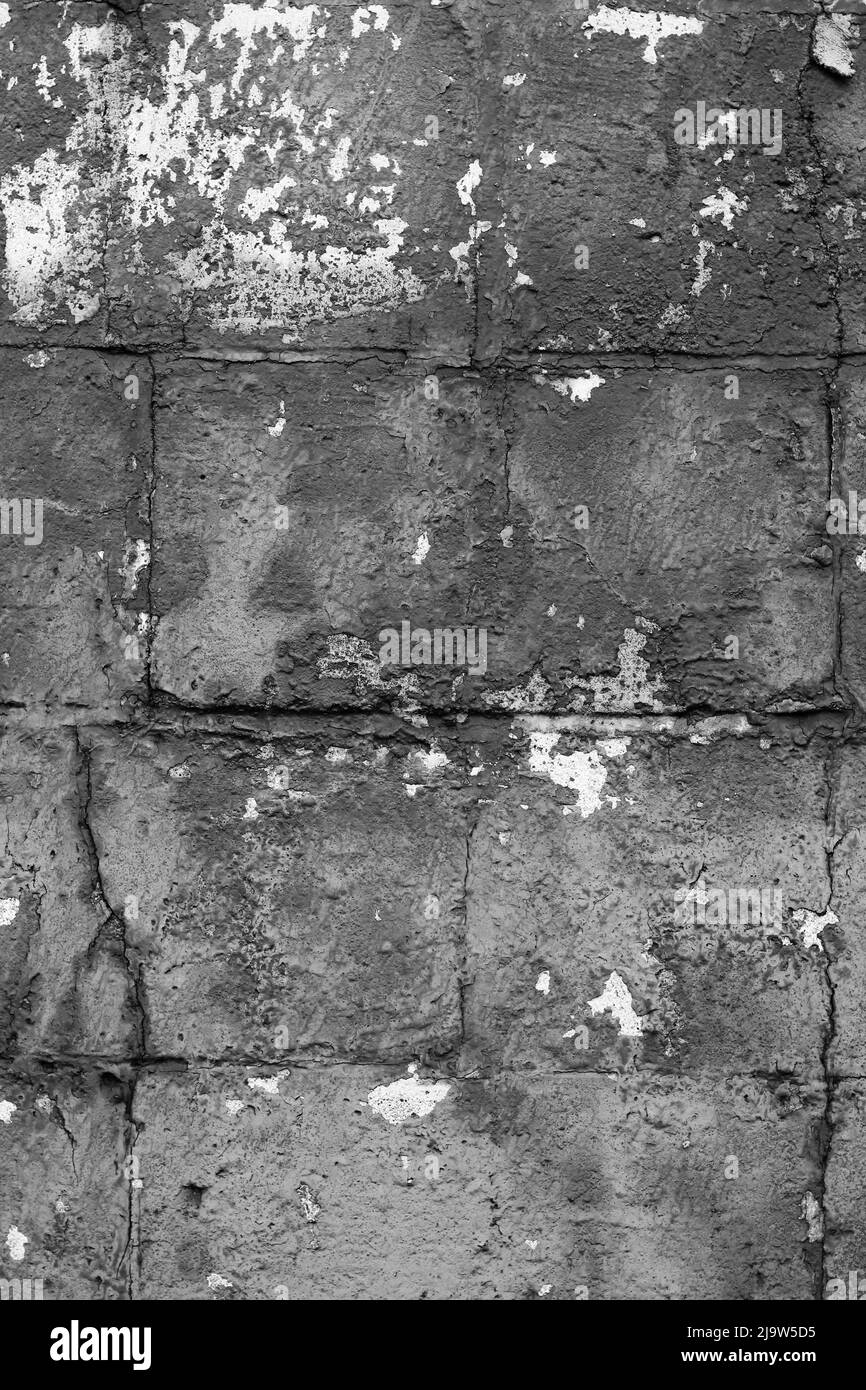 Old busted weathered worn concrete block wall in black and white Stock ...