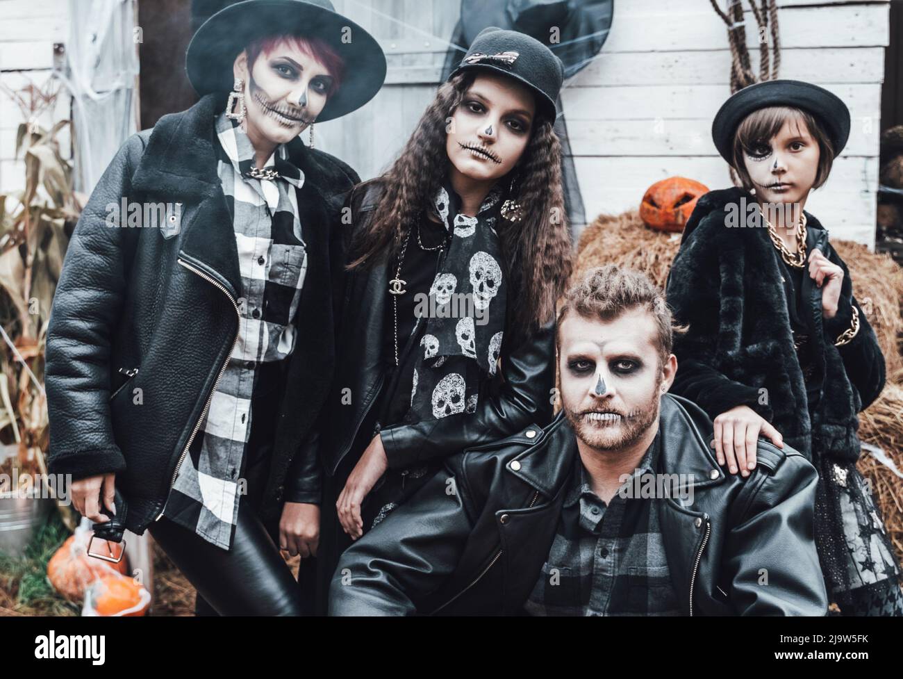 Scary family, mother, father, daughters celebrating halloween ...