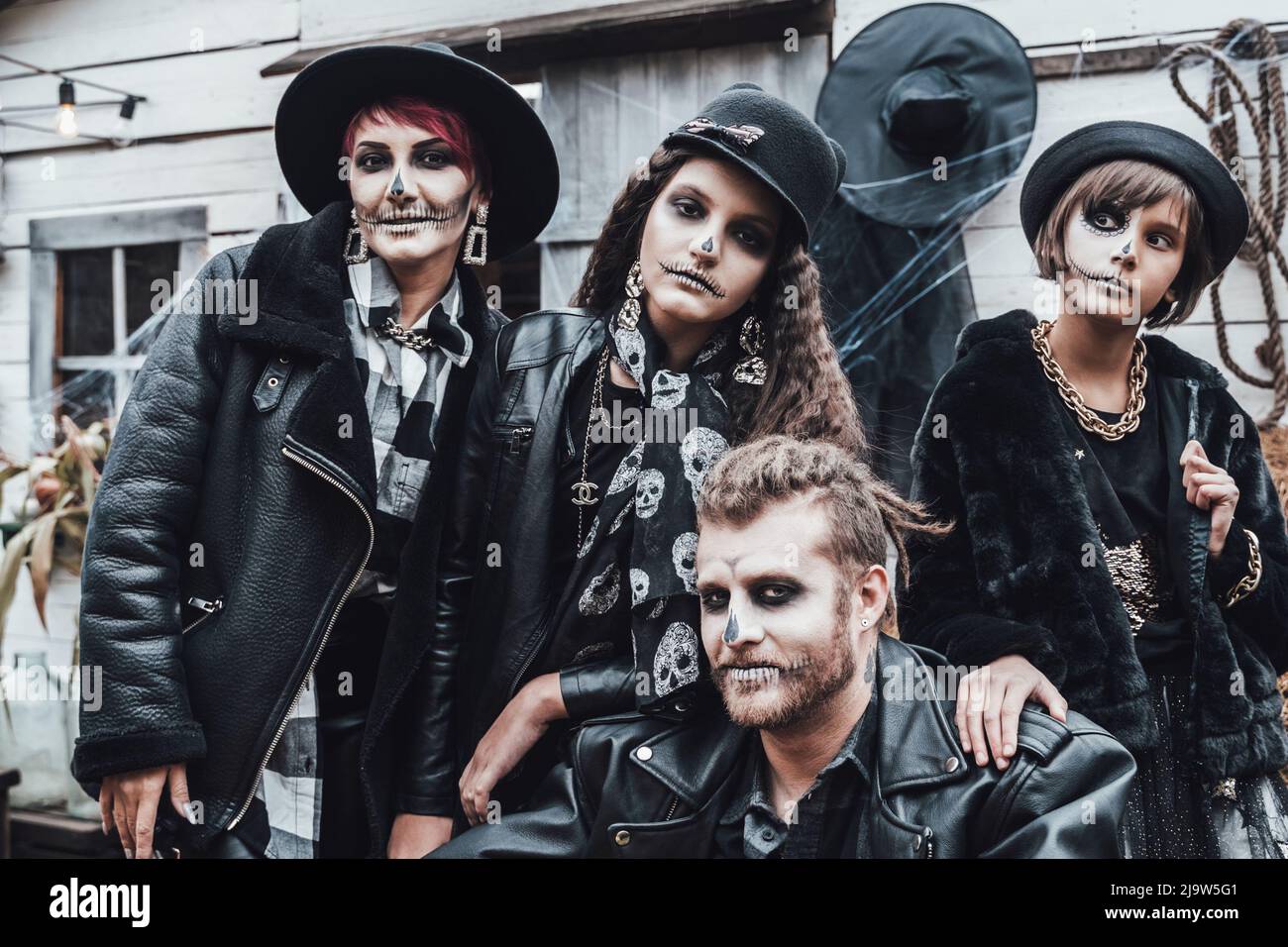 Scary family, mother, father, daughters celebrating halloween ...