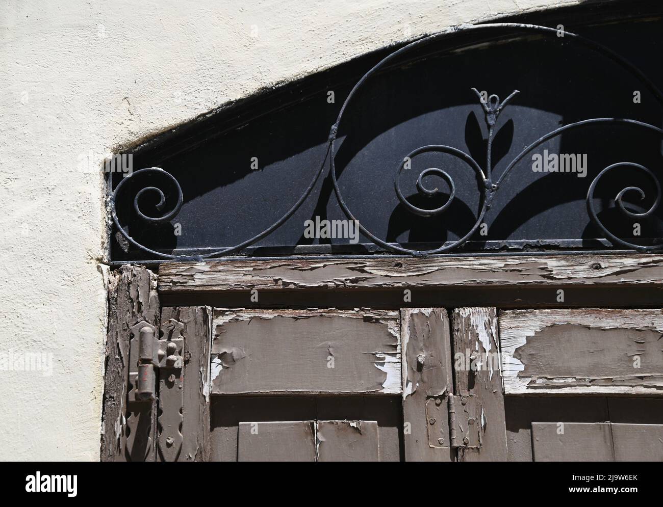 Old rural house antique wooden window shutters with chipped paint aged ...