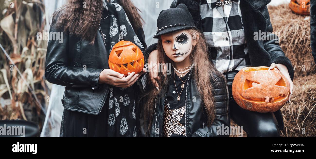 Scary family, mother, father, daughters celebrating halloween ...