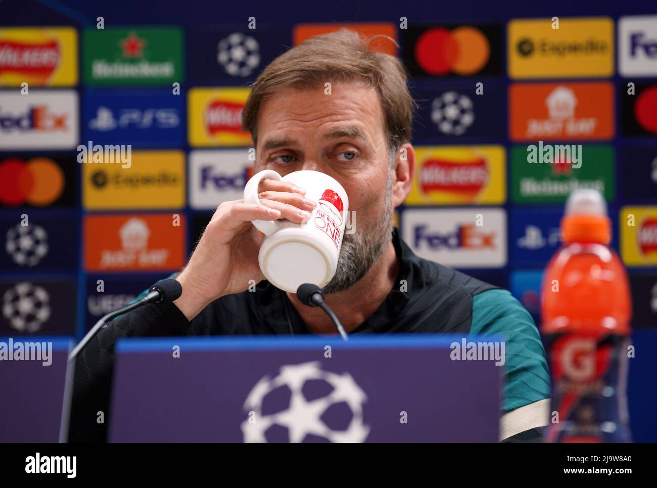 Liverpool manager Jurgen Klopp using a mug with The Normal One on it ...