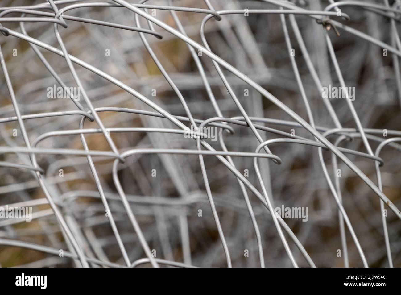 Rolls of wire fence ready to be setup on garden Stock Photo - Alamy