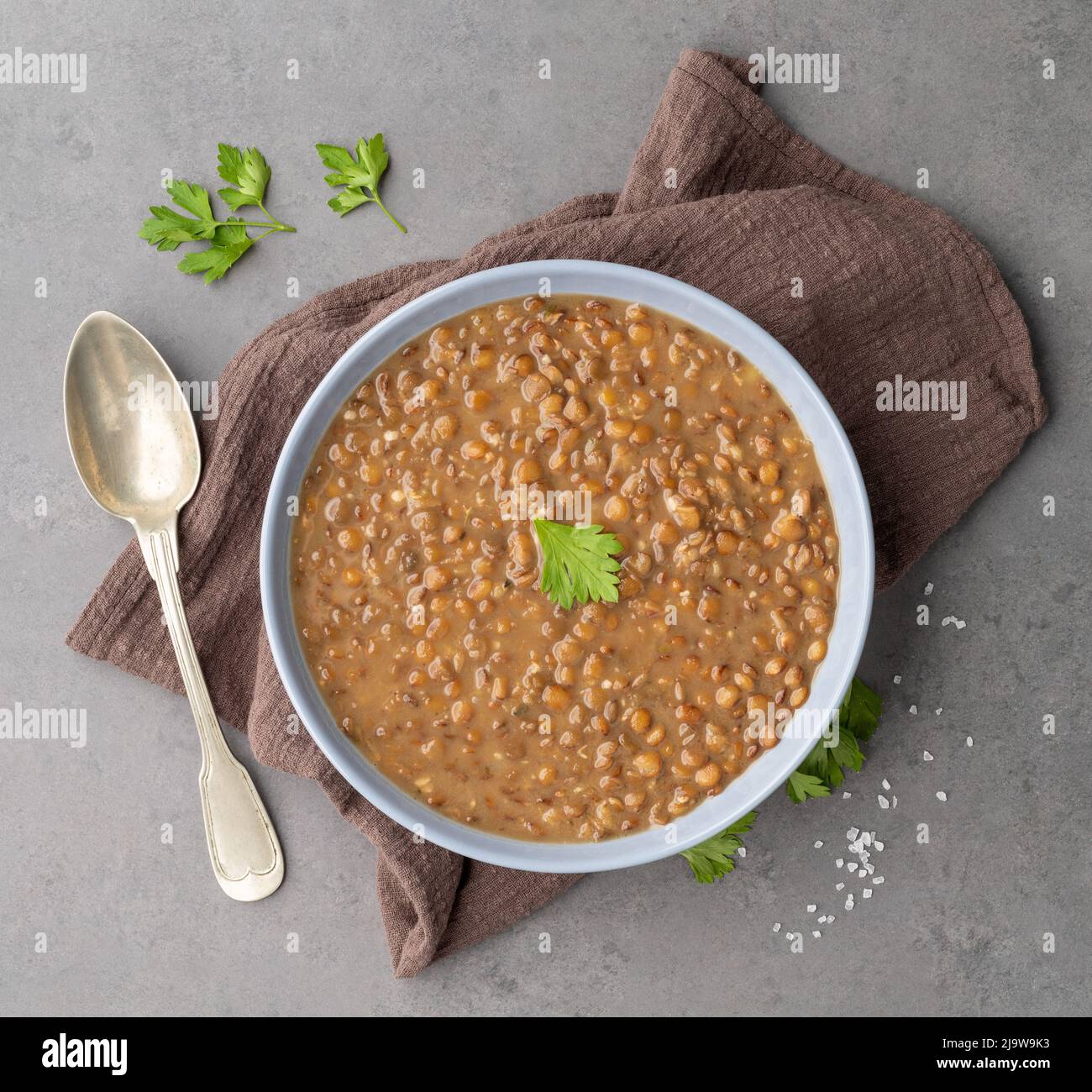 Lentil soup in a bowl with seasoning over stone background Stock Photo ...