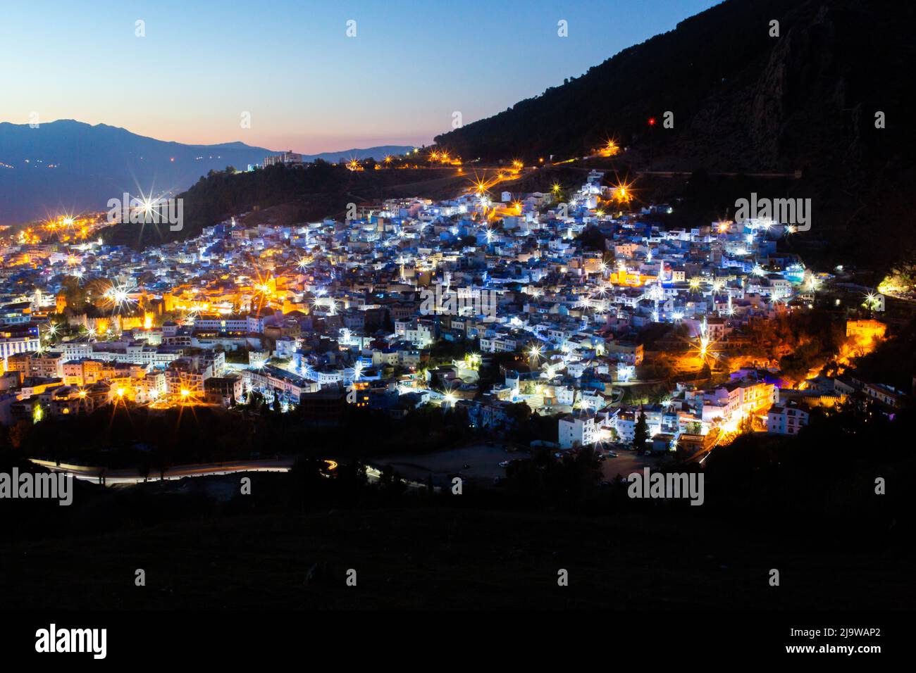 Cityscape of the blue city Chefchaouen by night Stock Photo - Alamy