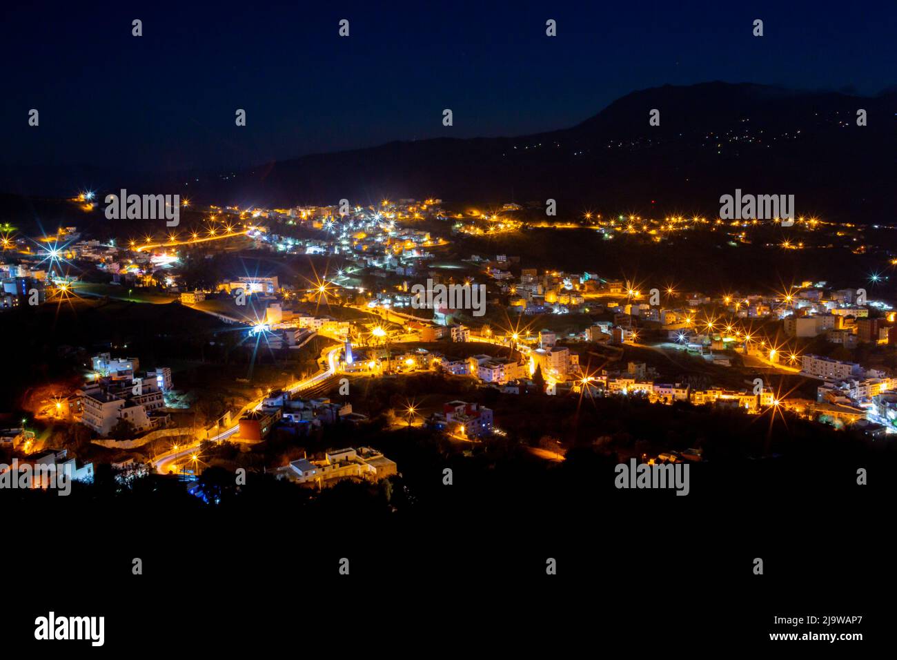 Cityscape of the blue city Chefchaouen by night Stock Photo - Alamy