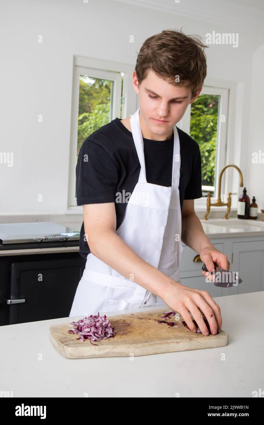 Boy cooking chopping hi-res stock photography and images - Alamy