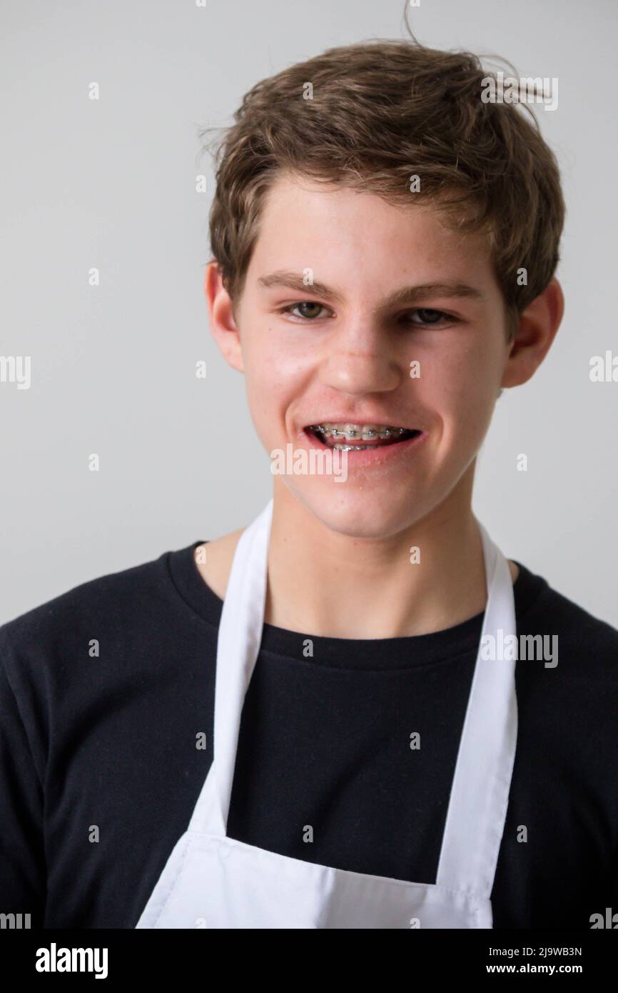 Teen boy cooking in the kitchen hi-res stock photography and images - Alamy