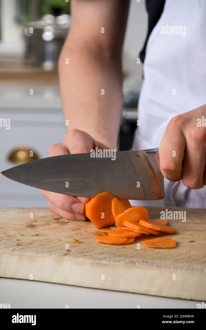 Chopping a carrot hi-res stock photography and images - Alamy