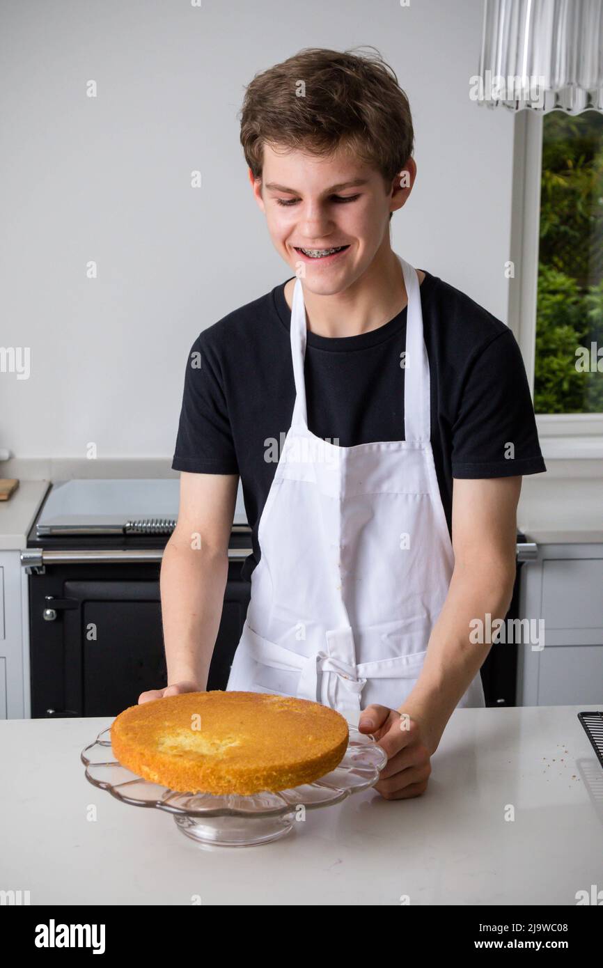 A teenage boy in a domestic kitchen Stock Photo - Alamy