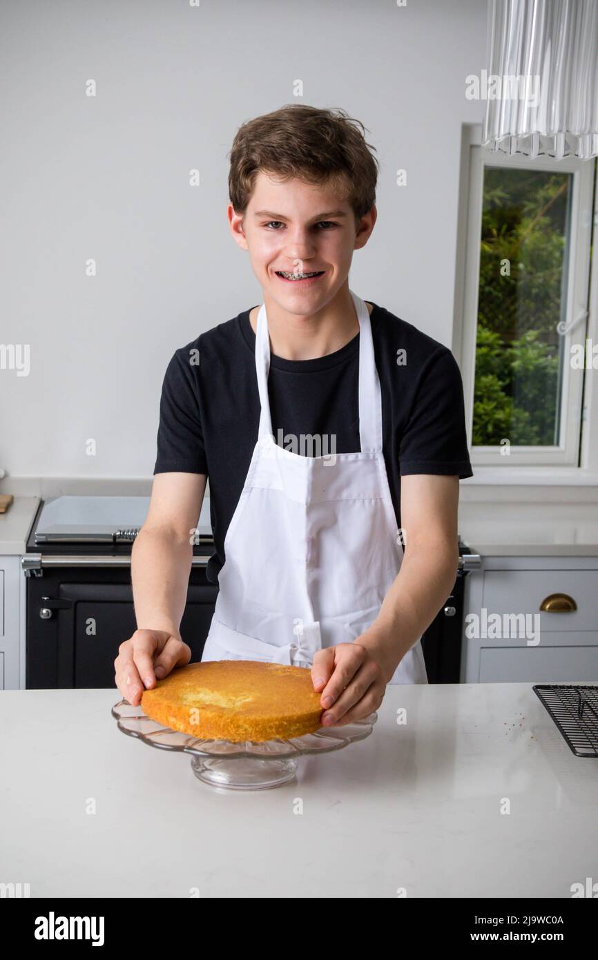 A teenage boy in a domestic kitchen Stock Photo - Alamy
