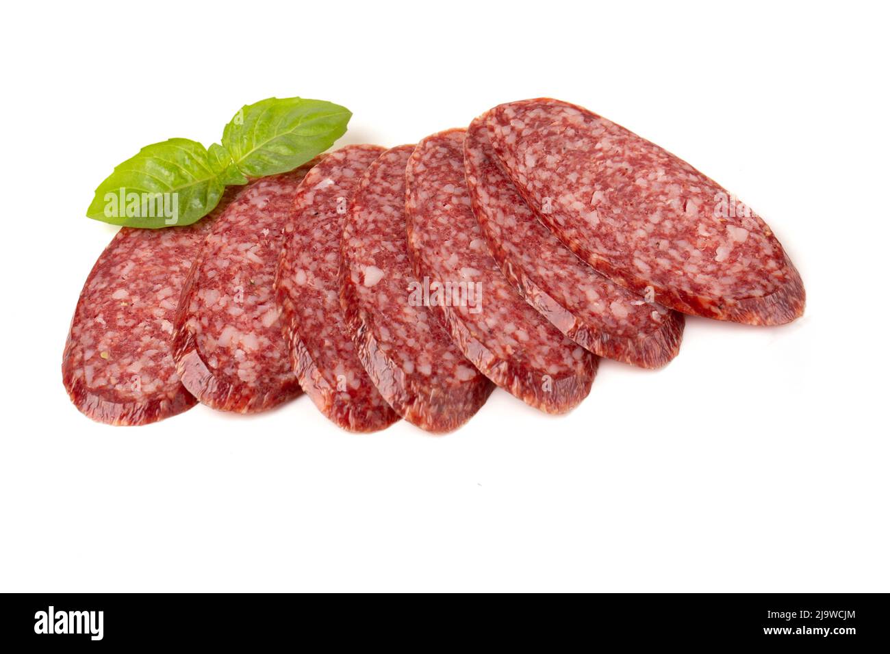 Beef Dried smoked Salami sausage sliced in close-up, isolated on a white background Stock Photo ...