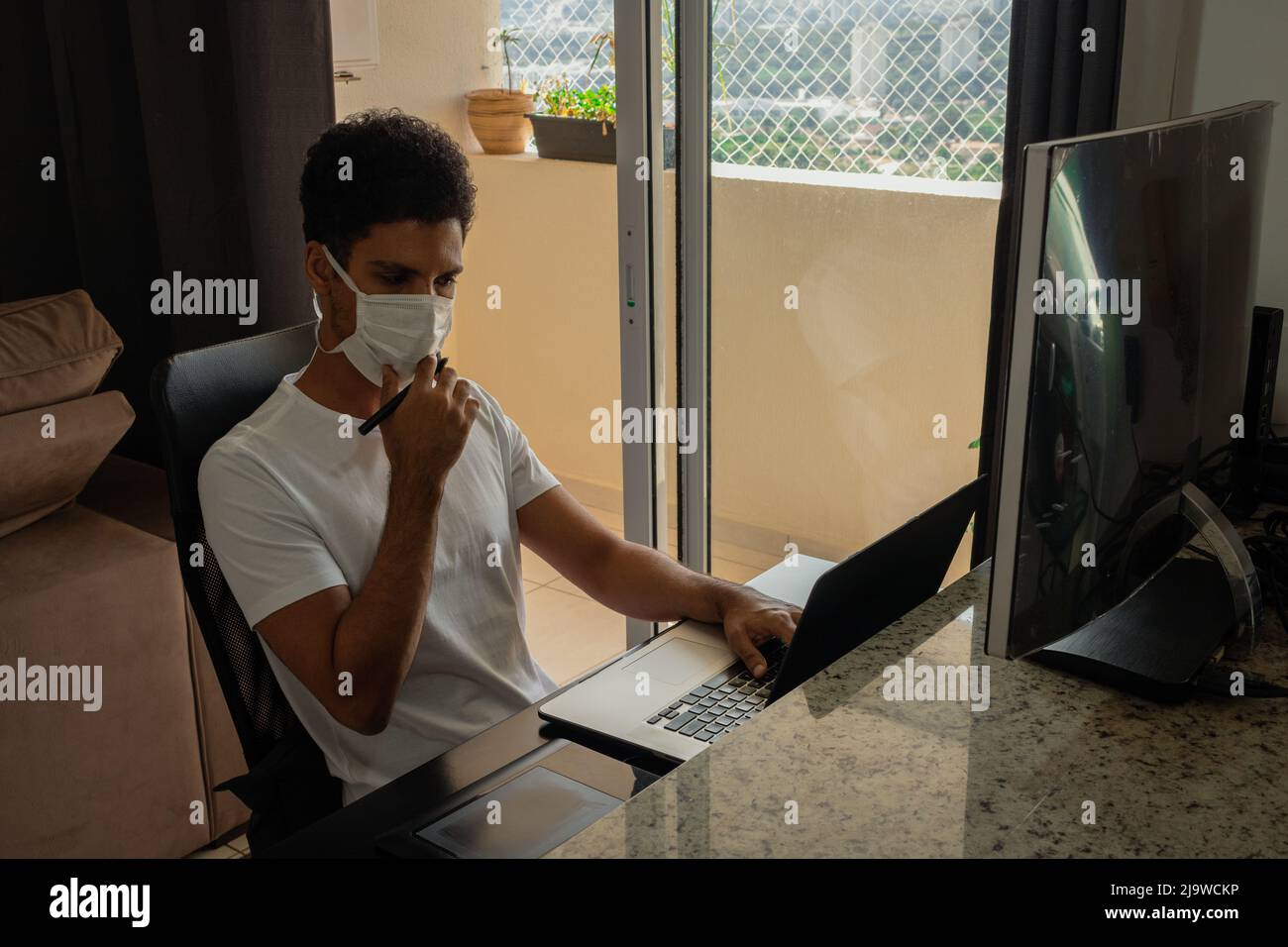 Black man at computer desk Stock Photo - Alamy