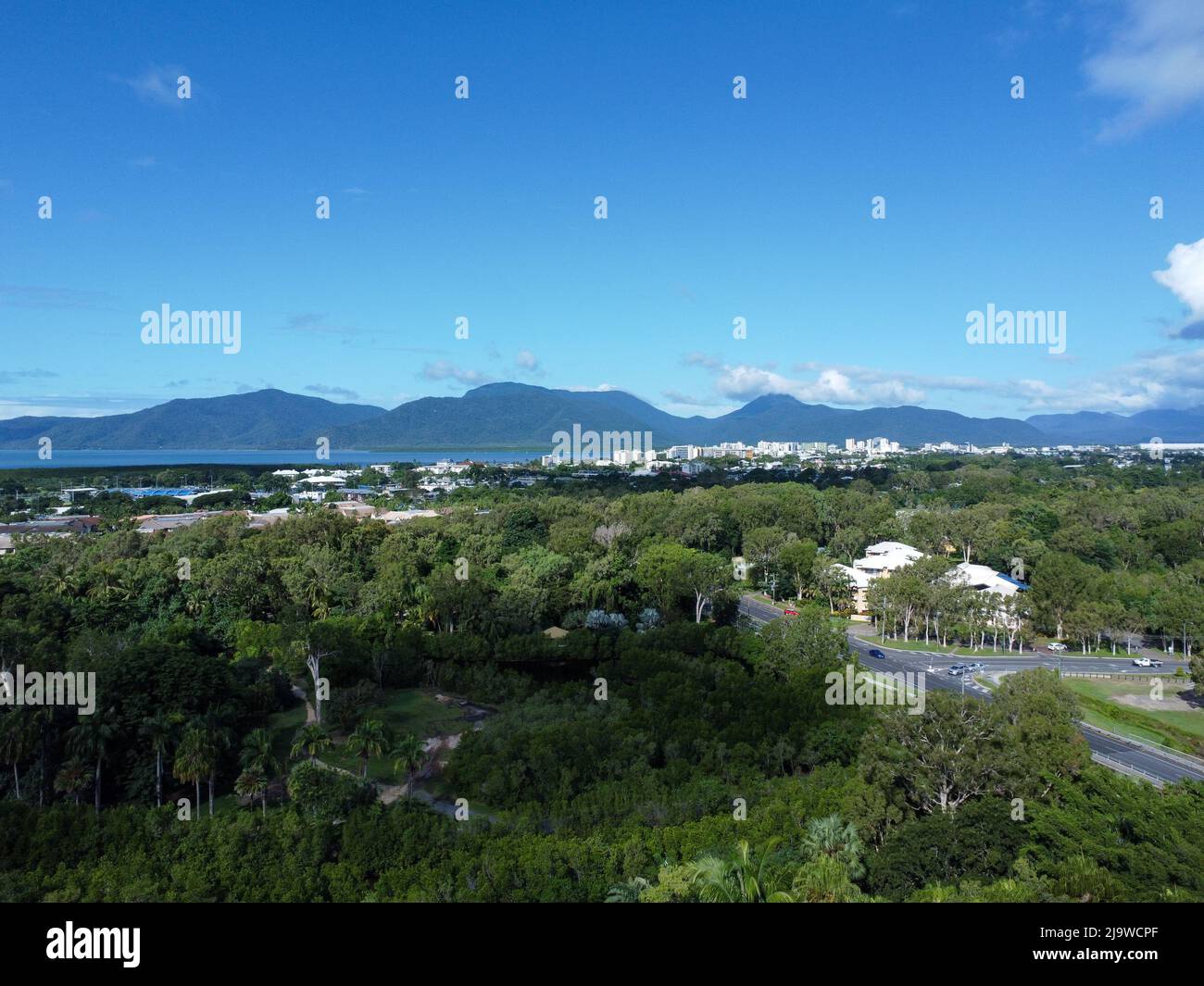 Aerial view of Cairns botanical gardens, city and mountains in ...
