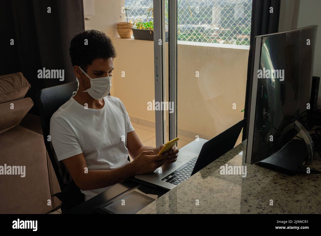 Black man at computer desk Stock Photo - Alamy
