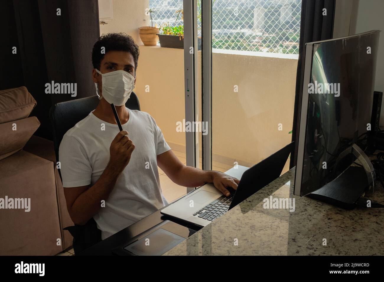 Black man at computer desk Stock Photo - Alamy