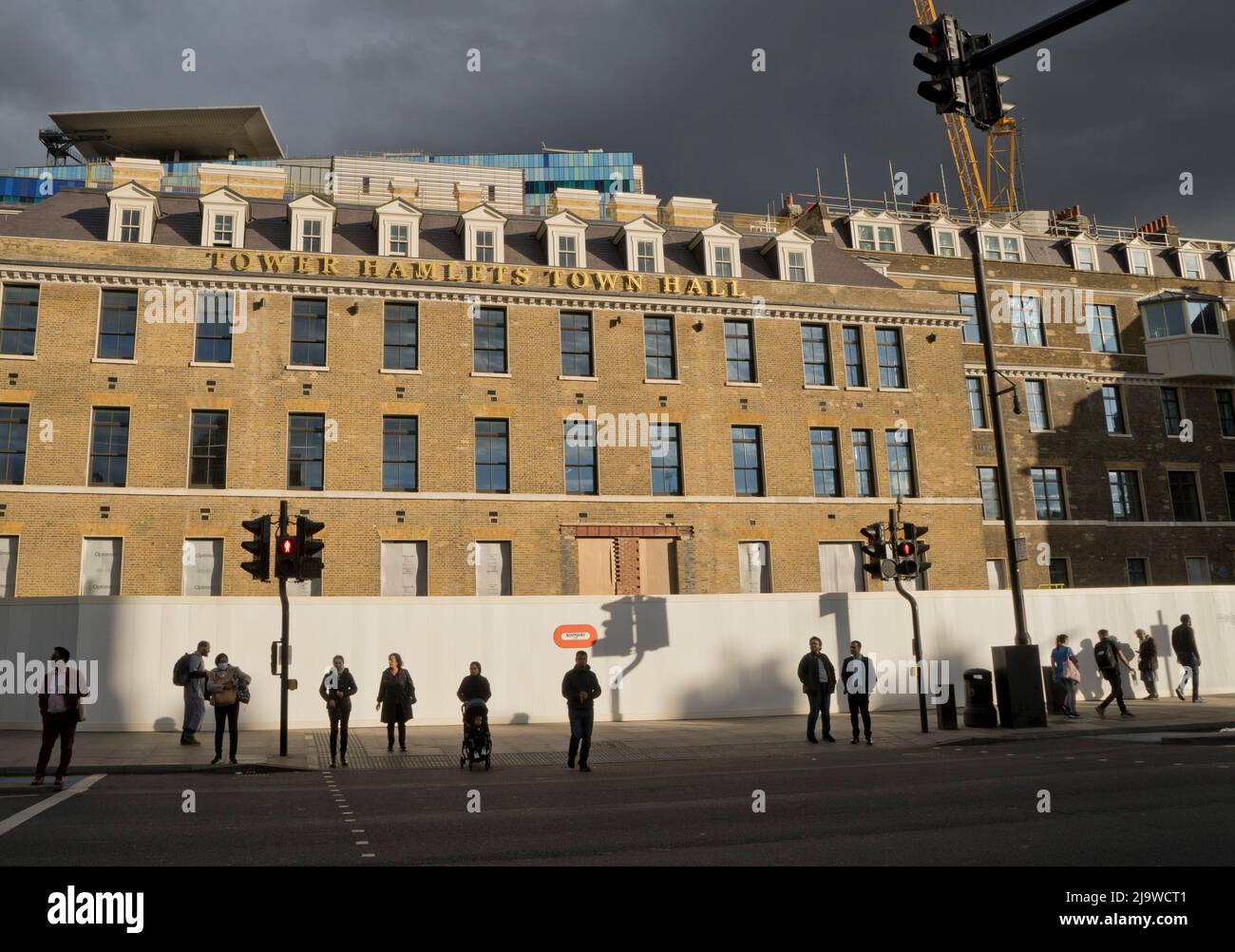 People crossing the road outside the refurbished Tower Hamlets Town ...