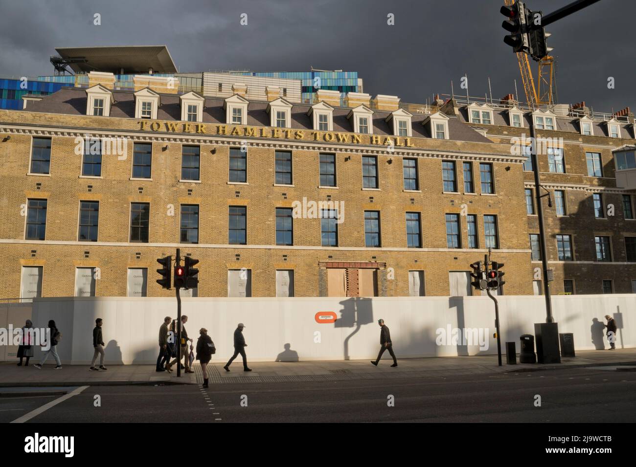 People crossing the road outside the refurbished Tower Hamlets Town ...