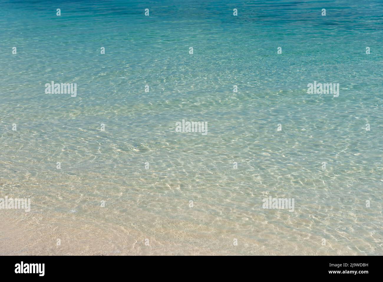 Turquoise colored ocean and sandy beach in Semporna, Sabah Borneo ...