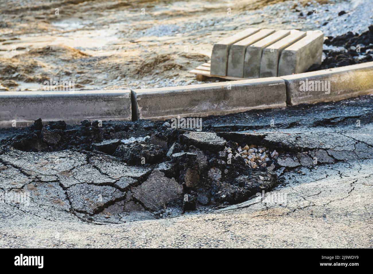 Asphalt swelling close-up. Pothole and pit on road Stock Photo - Alamy