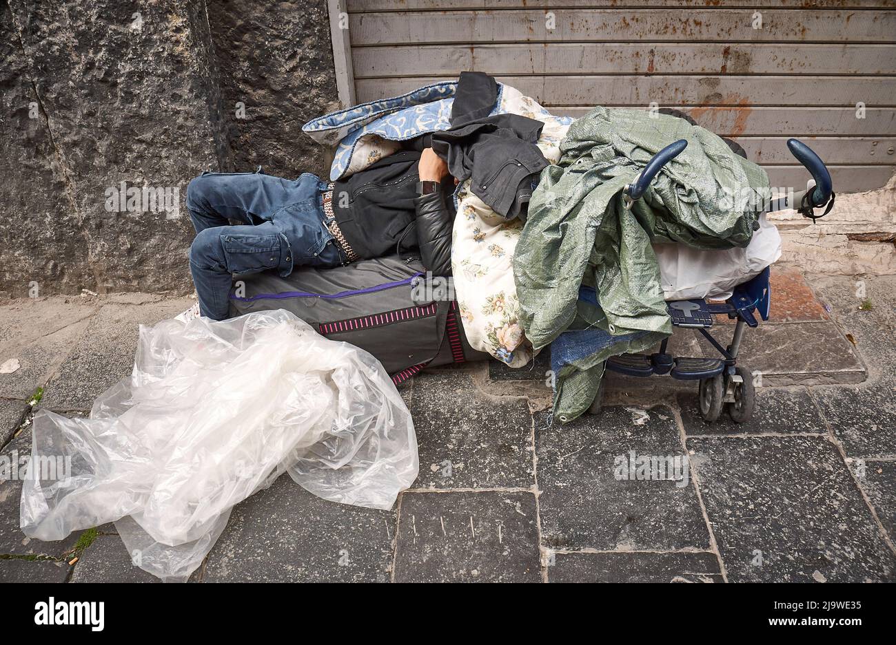 Sleeping place of a homeless person in Naples Stock Photo - Alamy