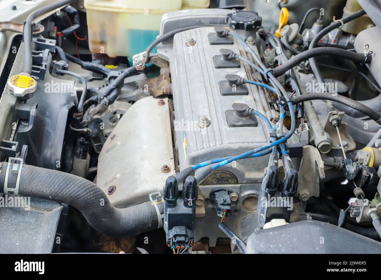 Old dirty engine under the hood of a car close-up Stock Photo - Alamy