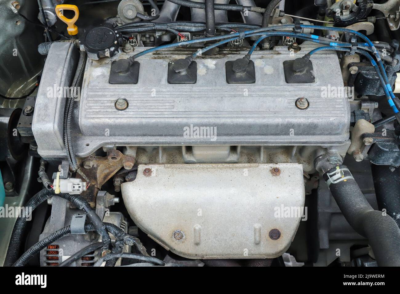 Old dirty engine under the hood of a car close-up Stock Photo - Alamy