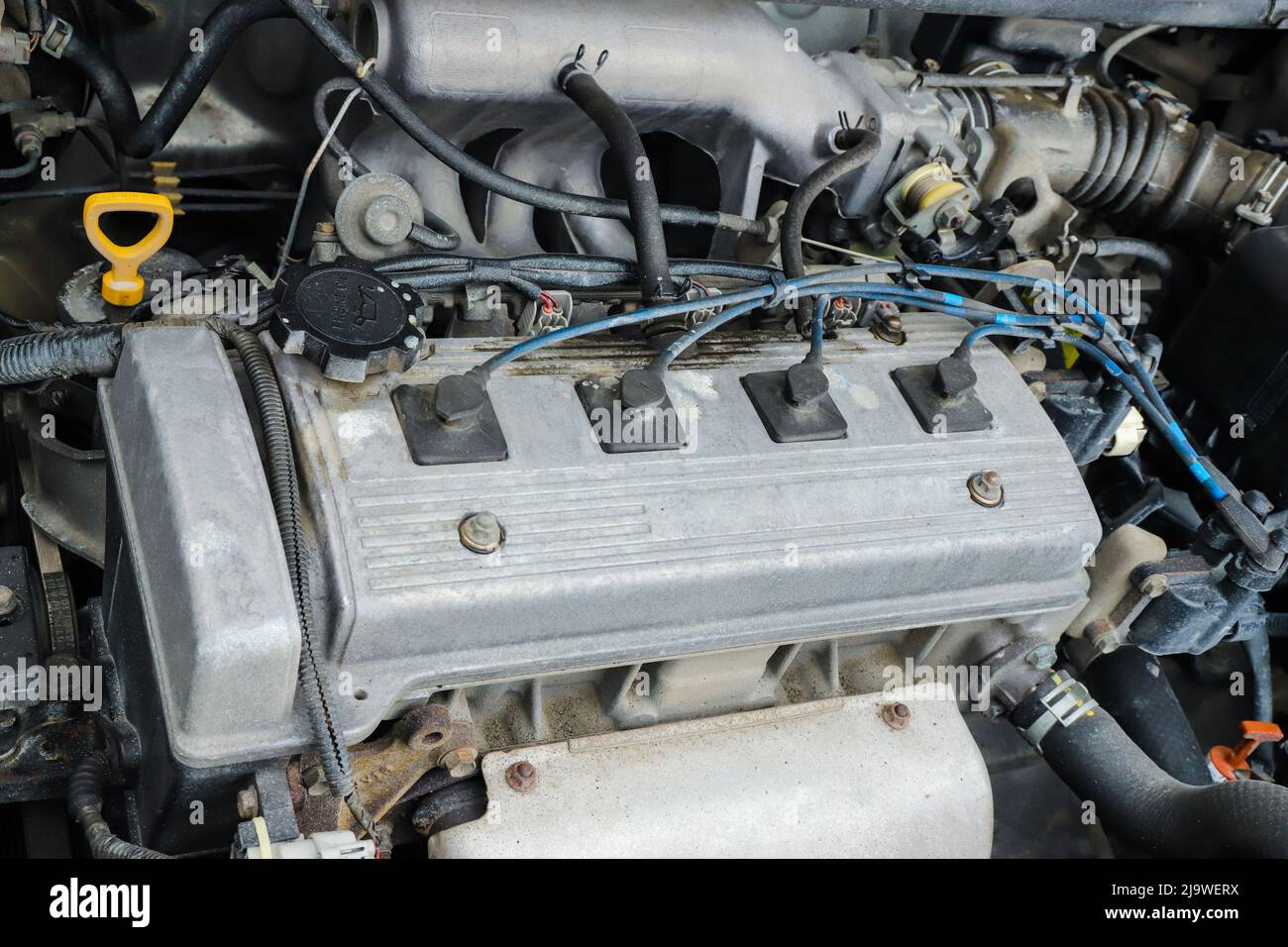 Old dirty engine under the hood of a car close-up Stock Photo - Alamy