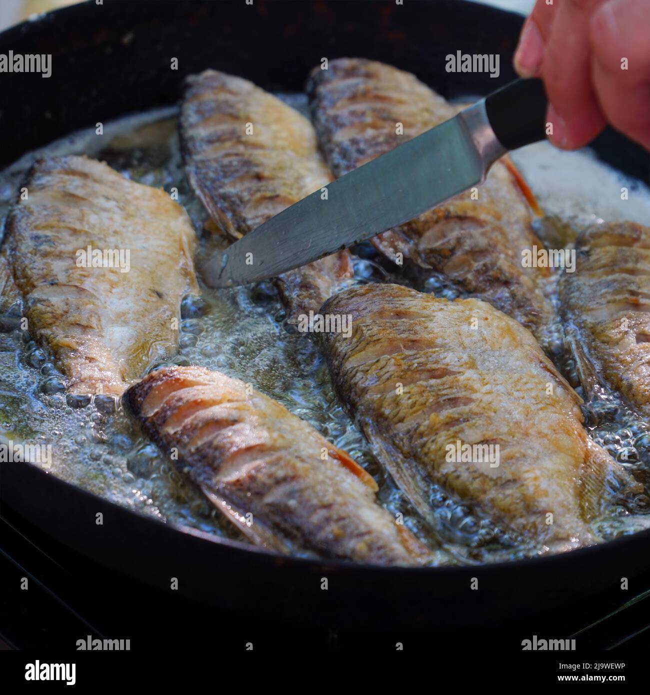 Fry small fish in frying hi-res stock photography and images - Alamy