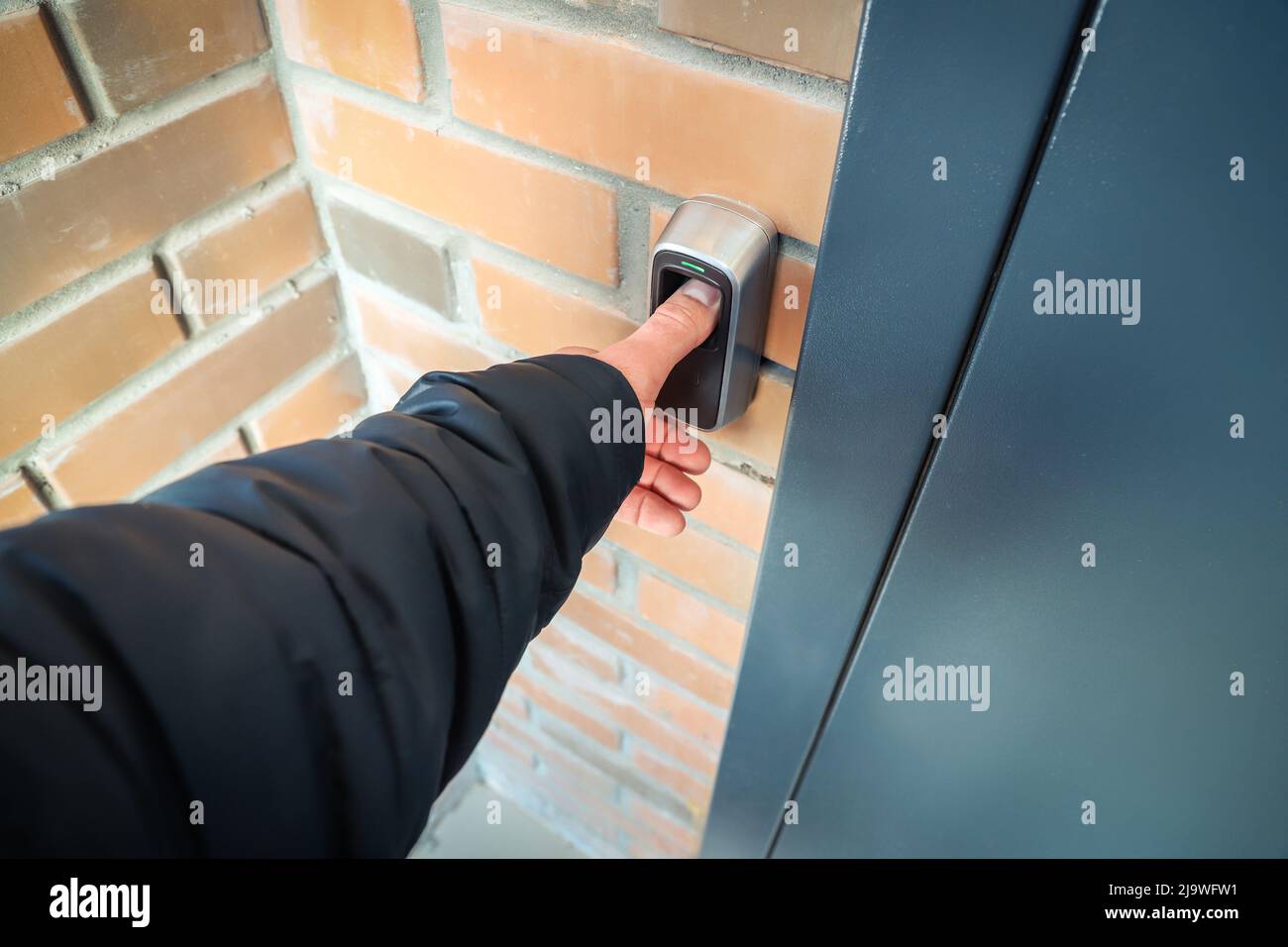 Device for scanning fingerprint. Residential building entrance. Brick ...