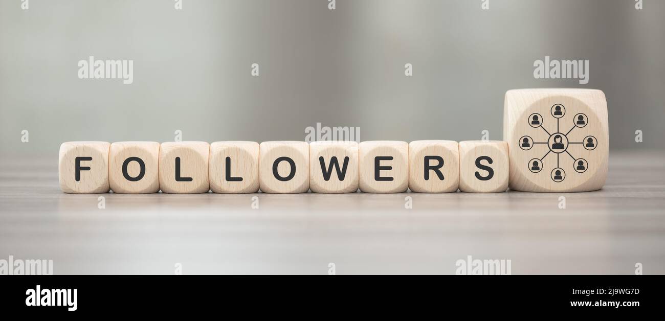 Wooden blocks with symbol of followers concept Stock Photo - Alamy