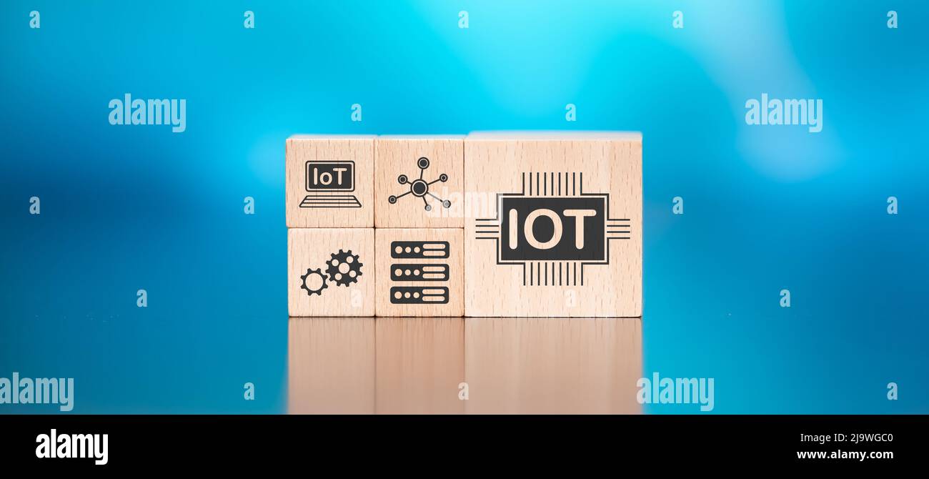 Wooden blocks with symbol of iot concept on blue background Stock Photo ...